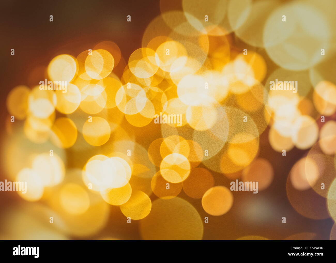 Festive background with natural bokeh and bright golden lights. Vintage ...