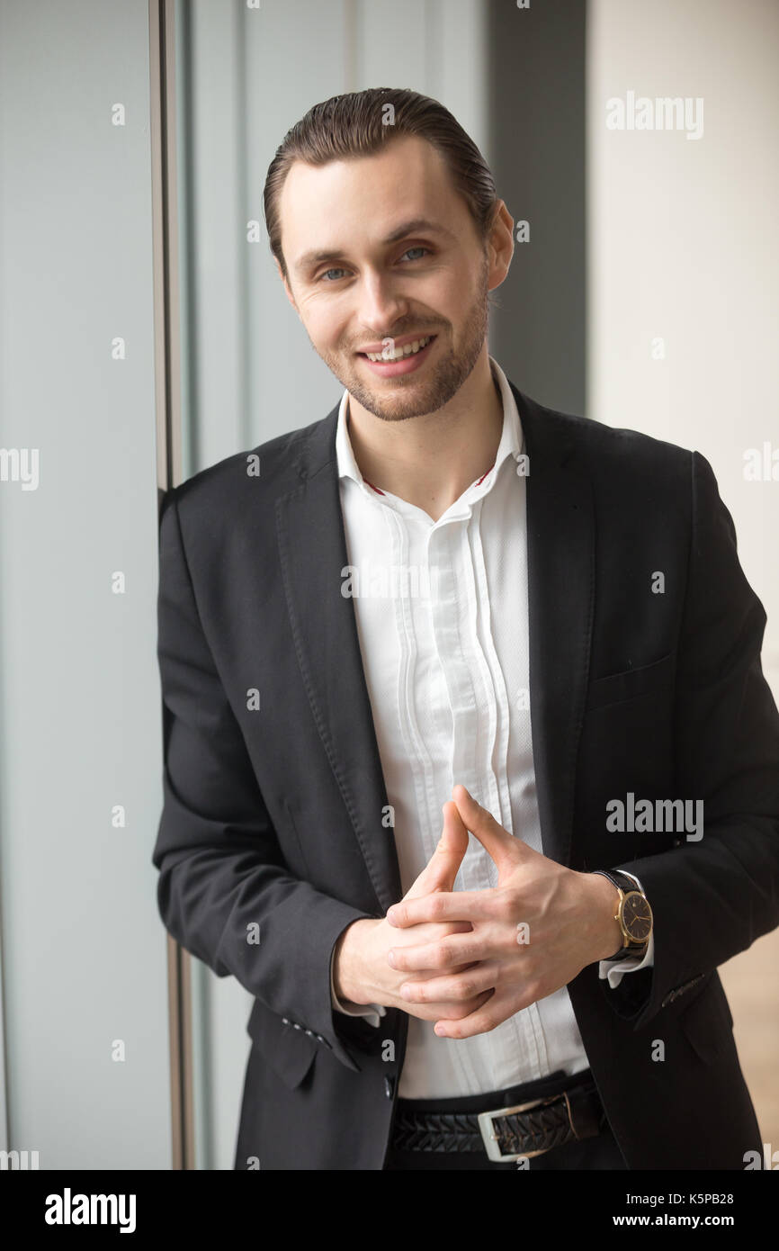 Optimistic handsome businessman looking camera hi-res stock photography ...