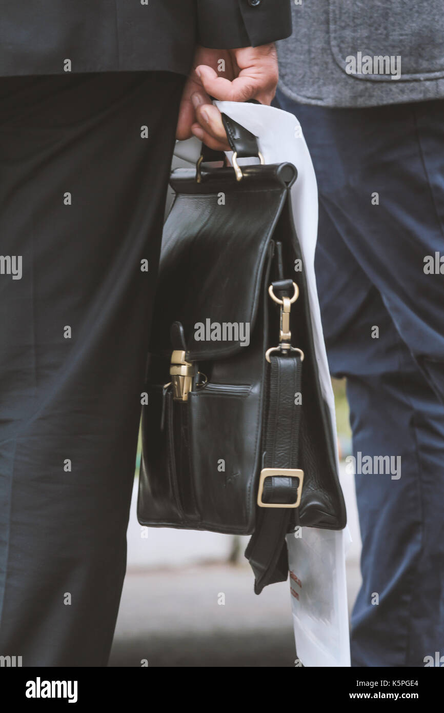 Holding Briefcase Stock Photos & Holding Briefcase Stock Images - Alamy