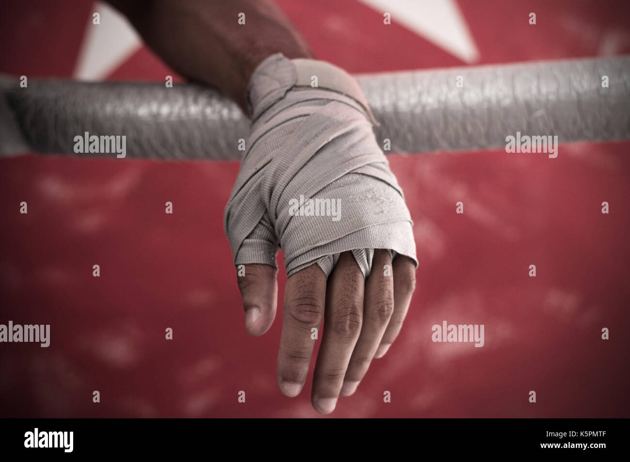 Close up of hand of boxer leaning on ropes on a boxing ring Stock Photo ...