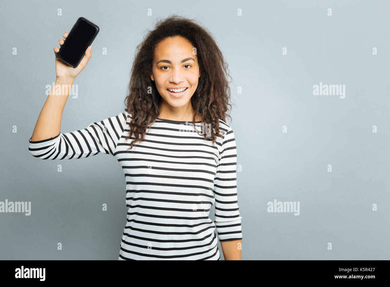 Raising right arm hi-res stock photography and images - Alamy