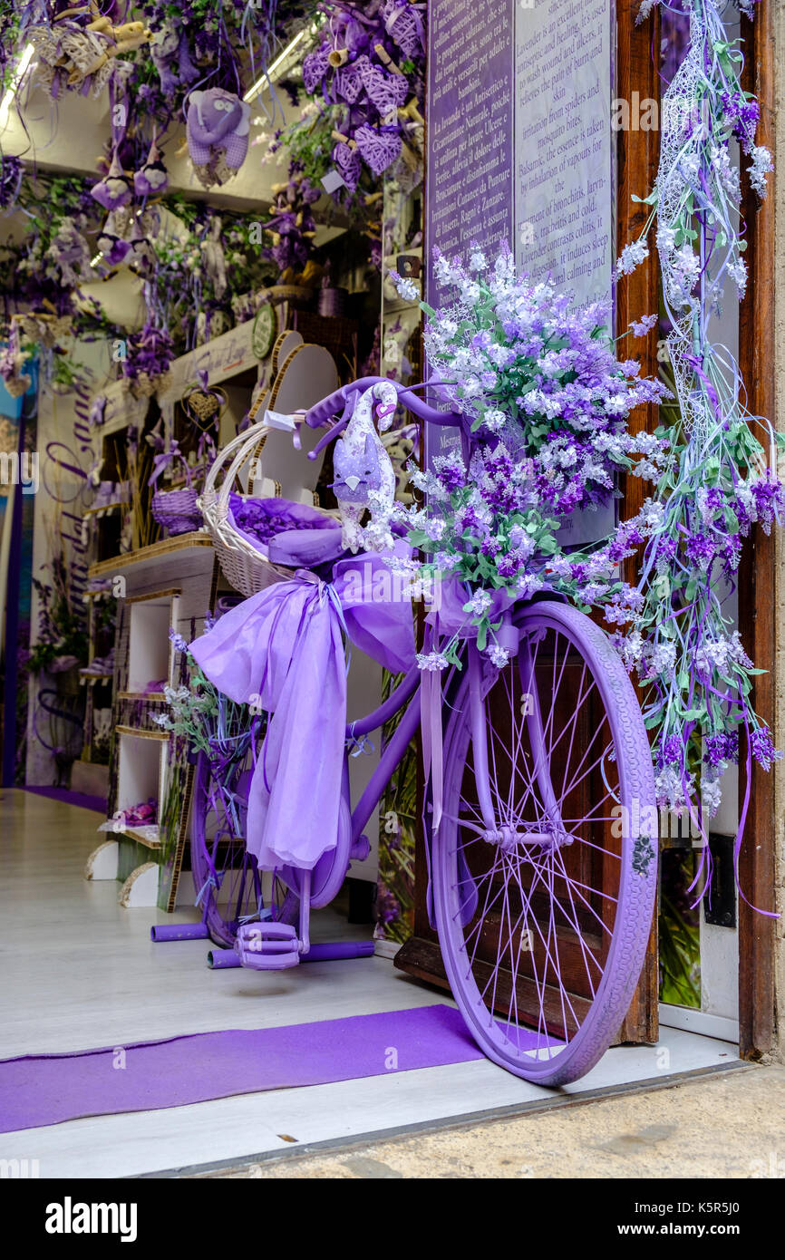 A purple bicycle is decorating a Lavender Shop between old houses of ...