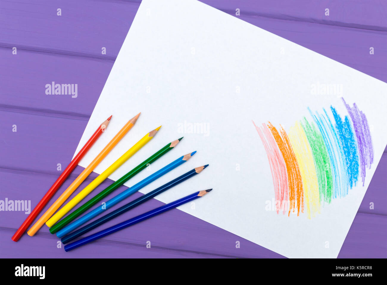Multi-color pencil with blank white paper Stock Photo - Alamy