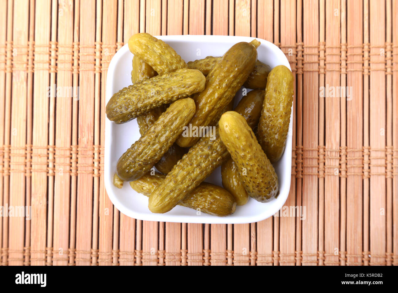 Pickles. Bowl of pickled gherkins cucumber with copy space. Cornichons ...