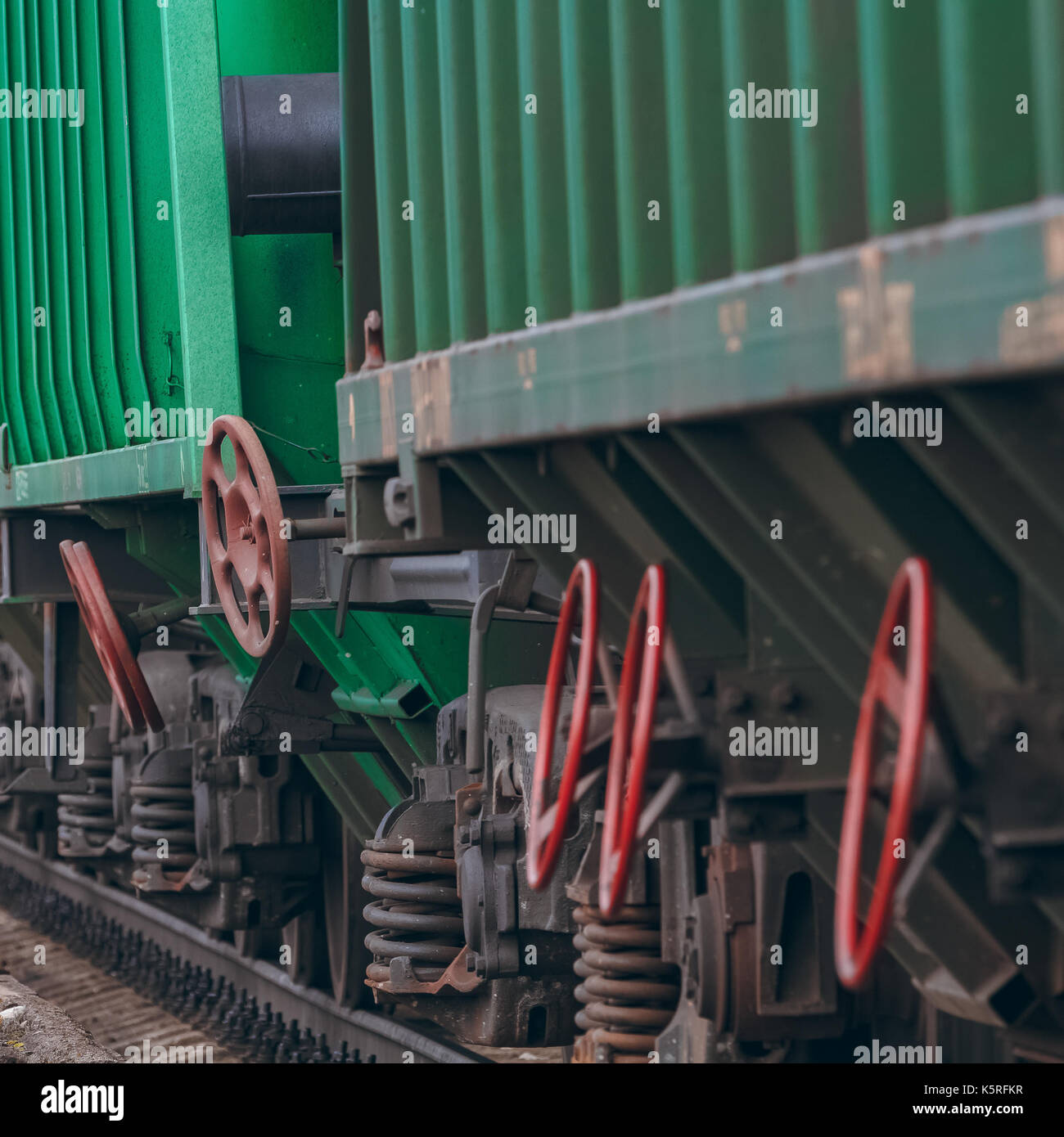 Green cargo wagons. Freight train in action Stock Photo - Alamy