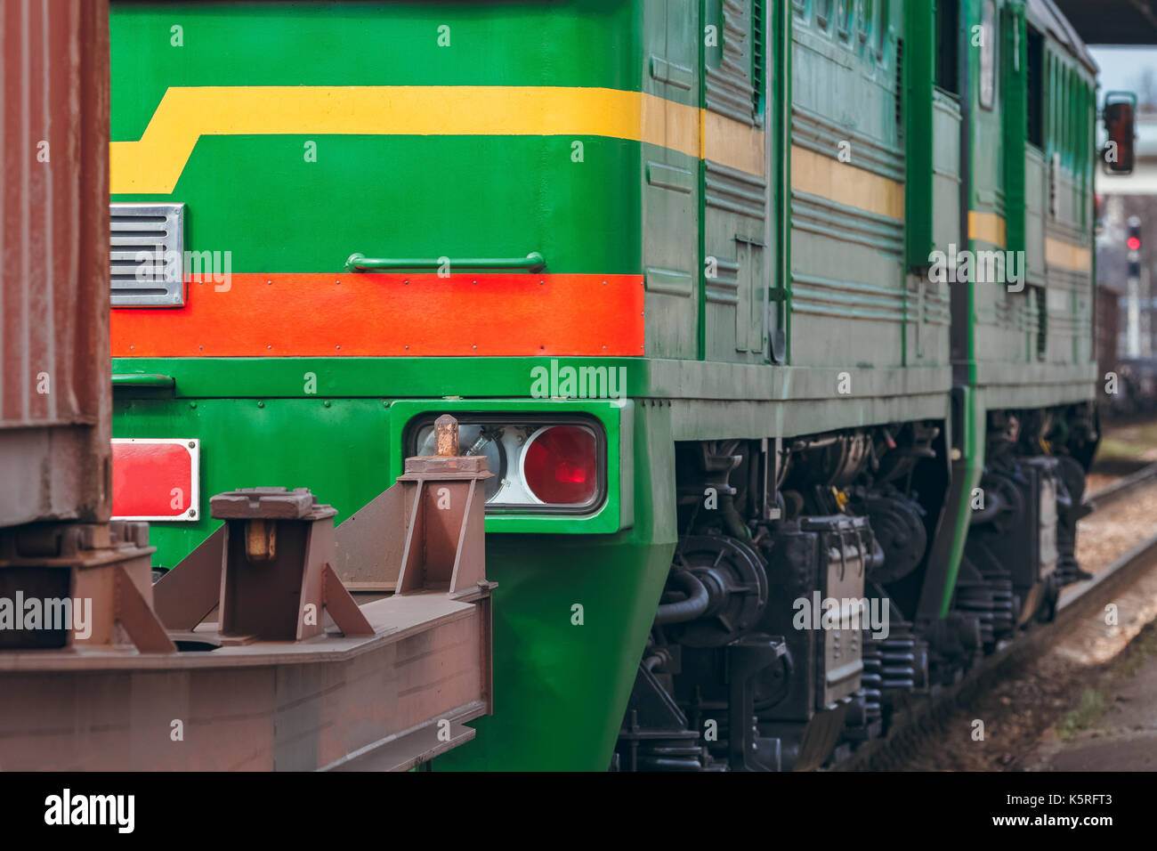 Green diesel cargo locomotive. Freight train in action Stock Photo - Alamy