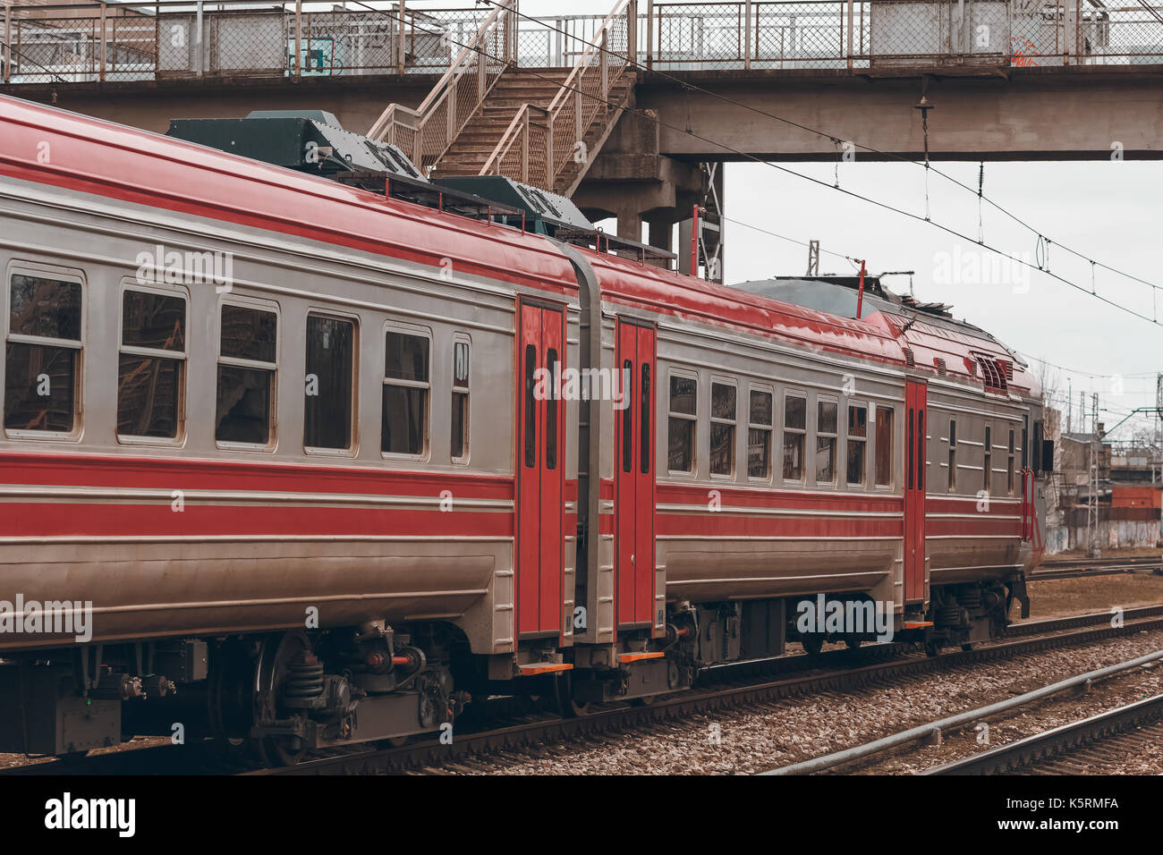 Red diesel passenger train driving at the old terminal Stock Photo - Alamy