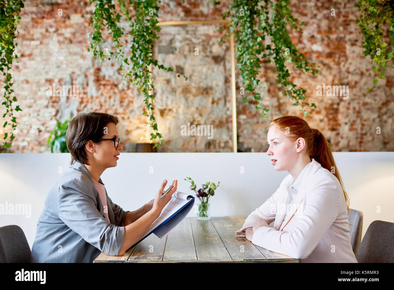 Interview in cafe Stock Photo - Alamy