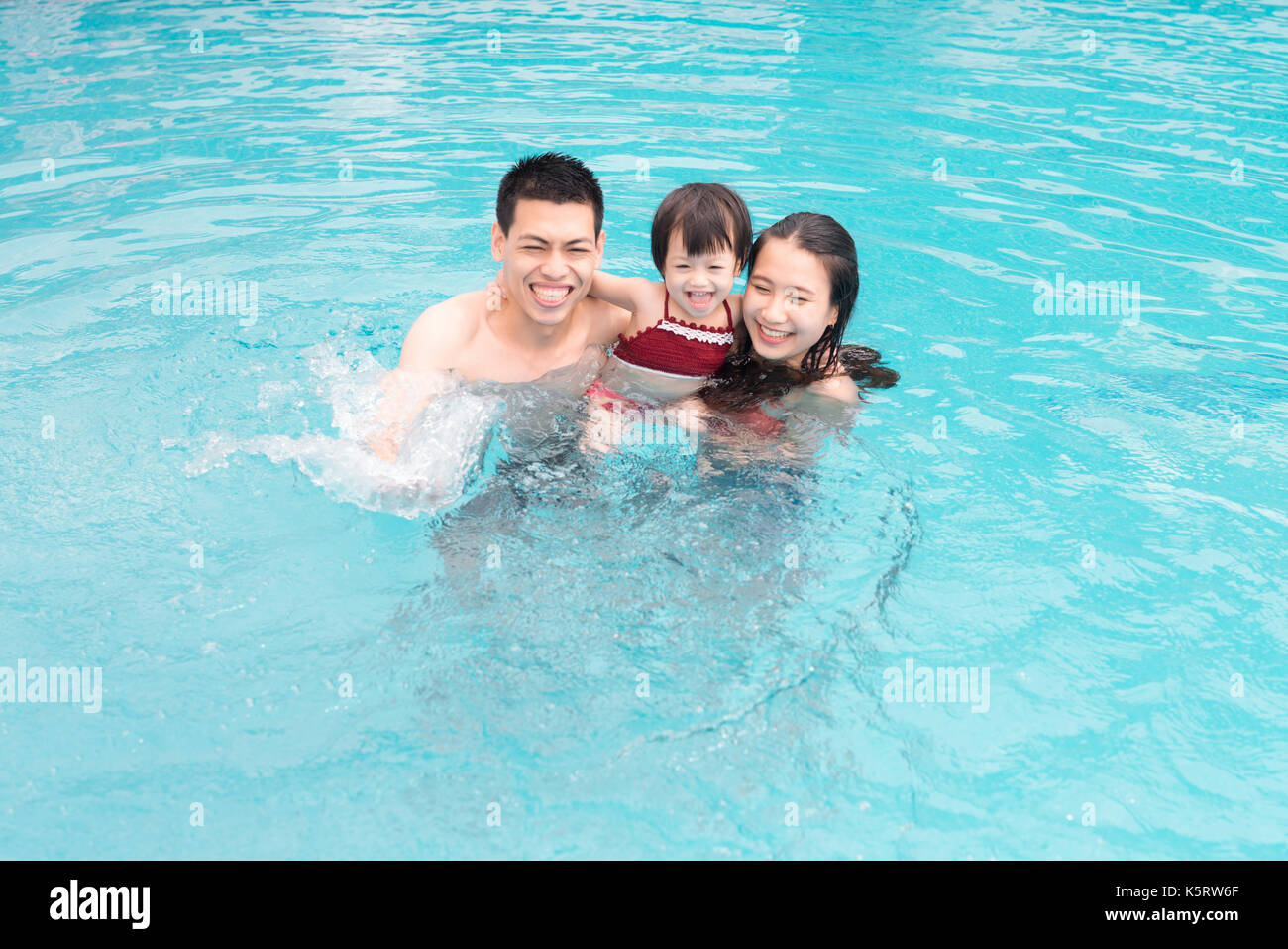 Asian family in swimming pool hi-res stock photography and images - Alamy
