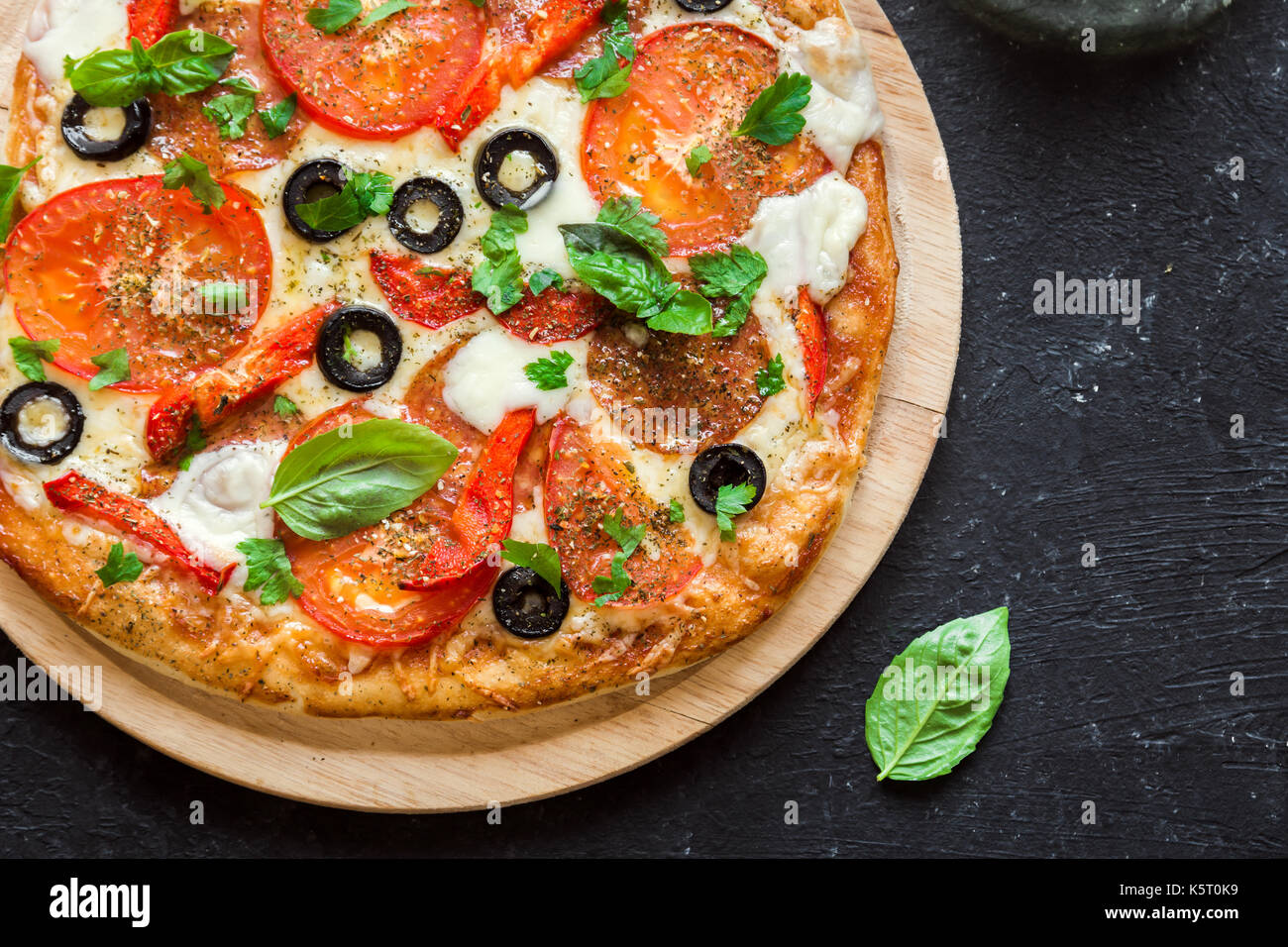 Italian Pizza with Tomatoes, Salami, black Olives and Mozzarella Cheese ...