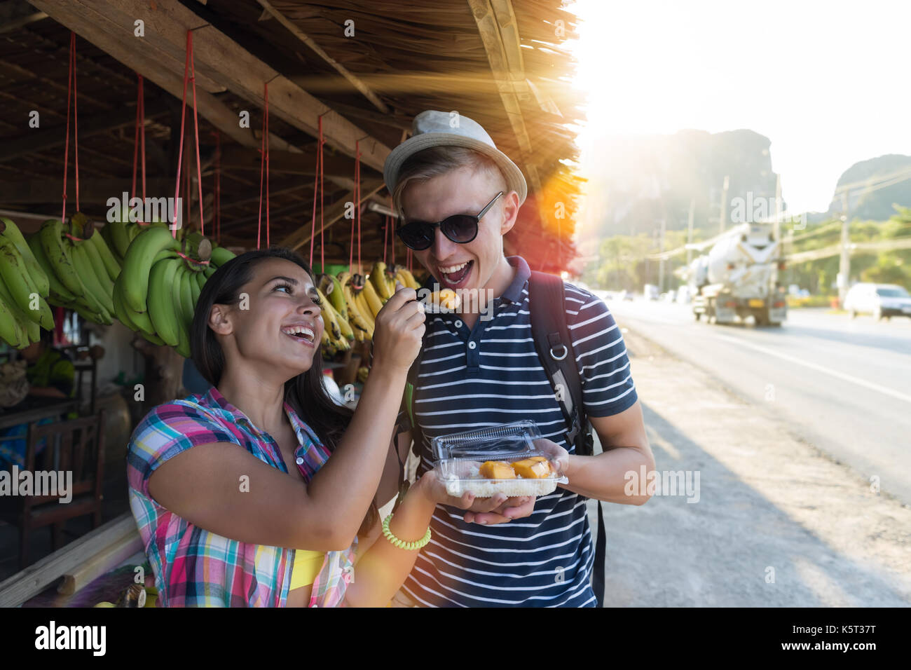 Cheerful Couple Eating Exotic Fruits On Traditional Street Market Happy ...