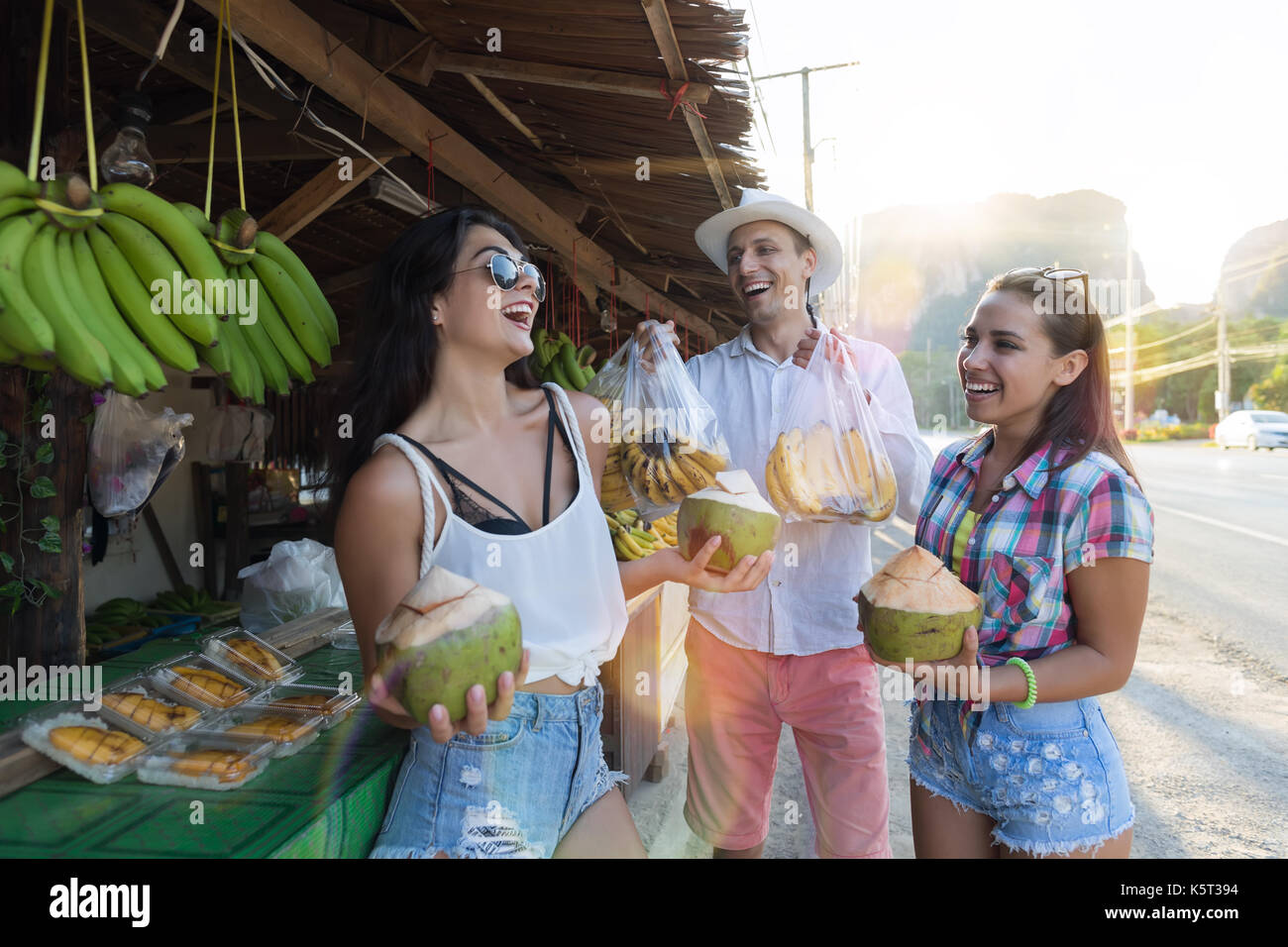 Group Of Tourists Talking Drinking Coconut On Thailand Street Market ...