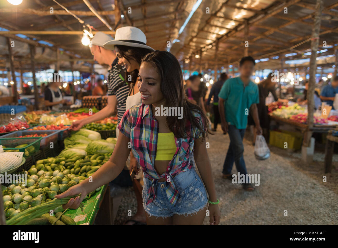 Tourists Choosing Vegetables On Traditional Asian Market Young People ...