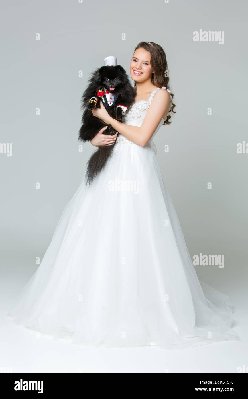 bride girl with spitz goom in wedding suit Stock Photo - Alamy