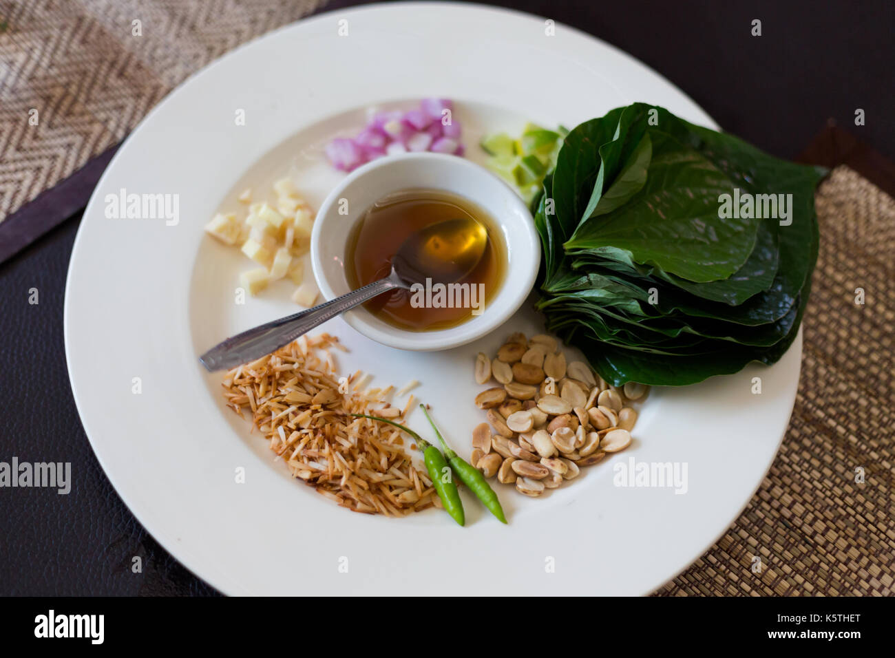 Popular thai snack Miang Kham made of betel leaf, ginger, onion, lime ...