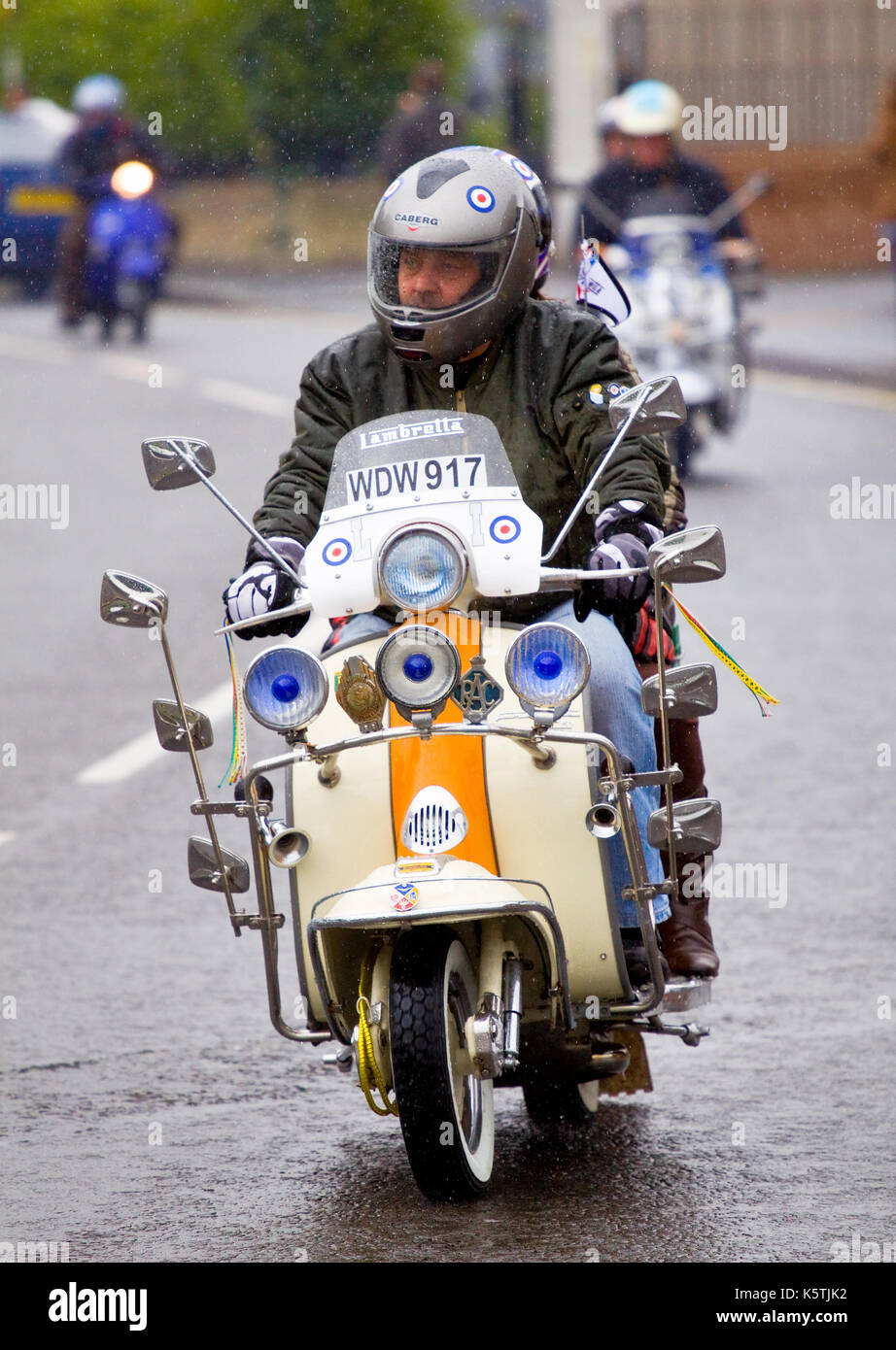Two men on scooter High Resolution Stock Photography and Images - Alamy