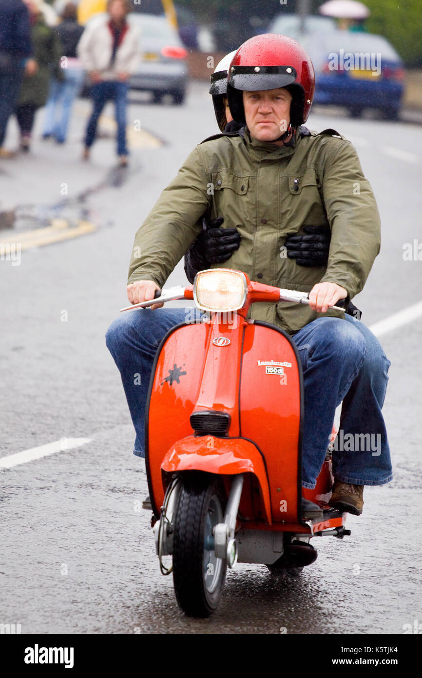 Two men on scooter High Resolution Stock Photography and Images - Alamy