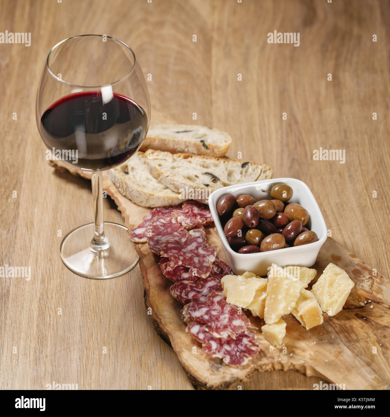 italian antipasti appetizers on wood table closeup Stock Photo - Alamy
