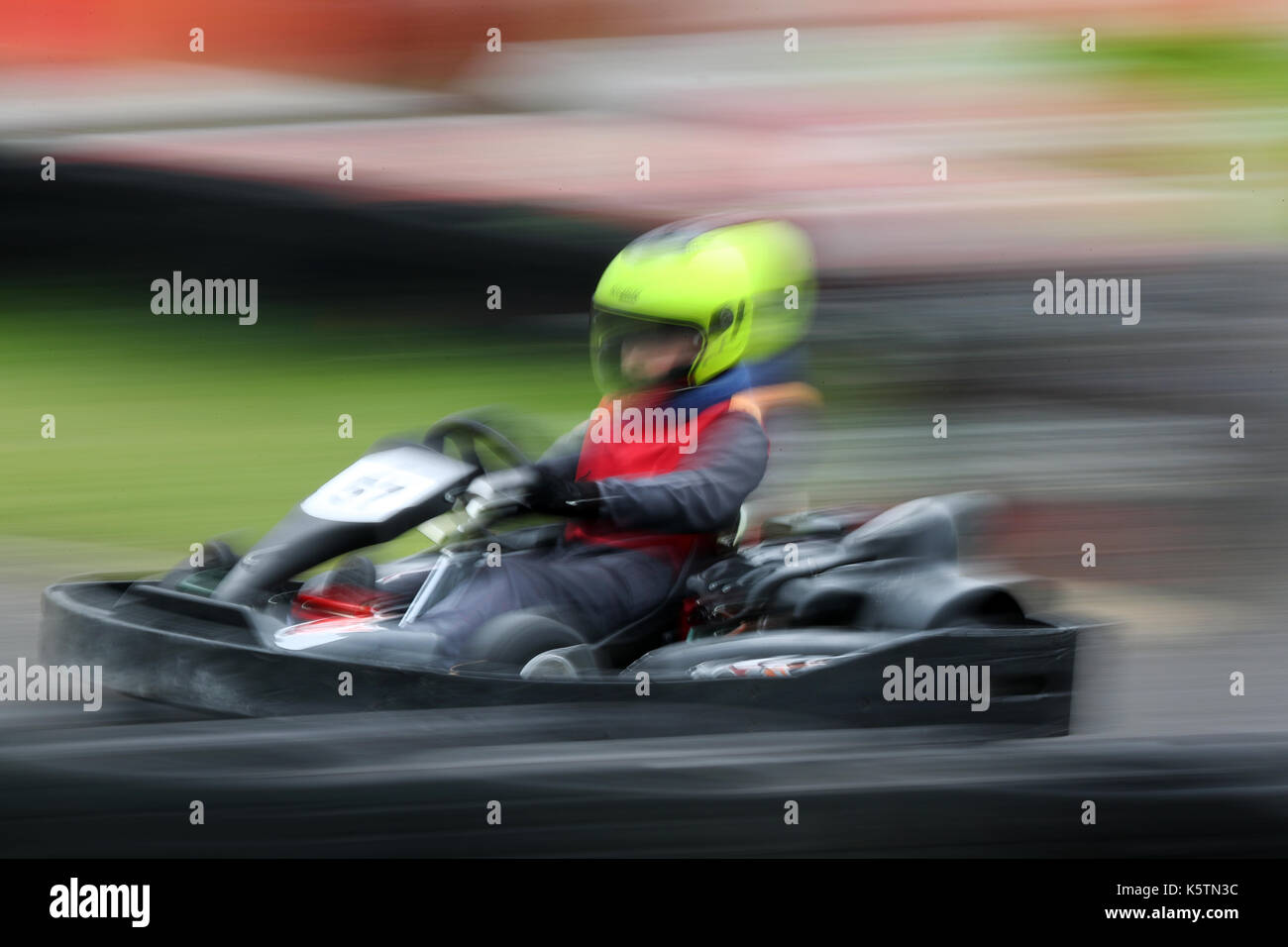 Young boys learn to drive karts on a track during a Junior Karting ...