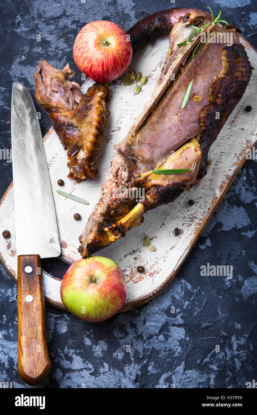 roasted duck with apples on the kitchen cutting board Stock Photo - Alamy