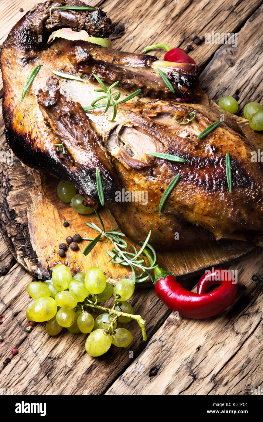 roasted duck with grapes on the kitchen cutting board Stock Photo - Alamy