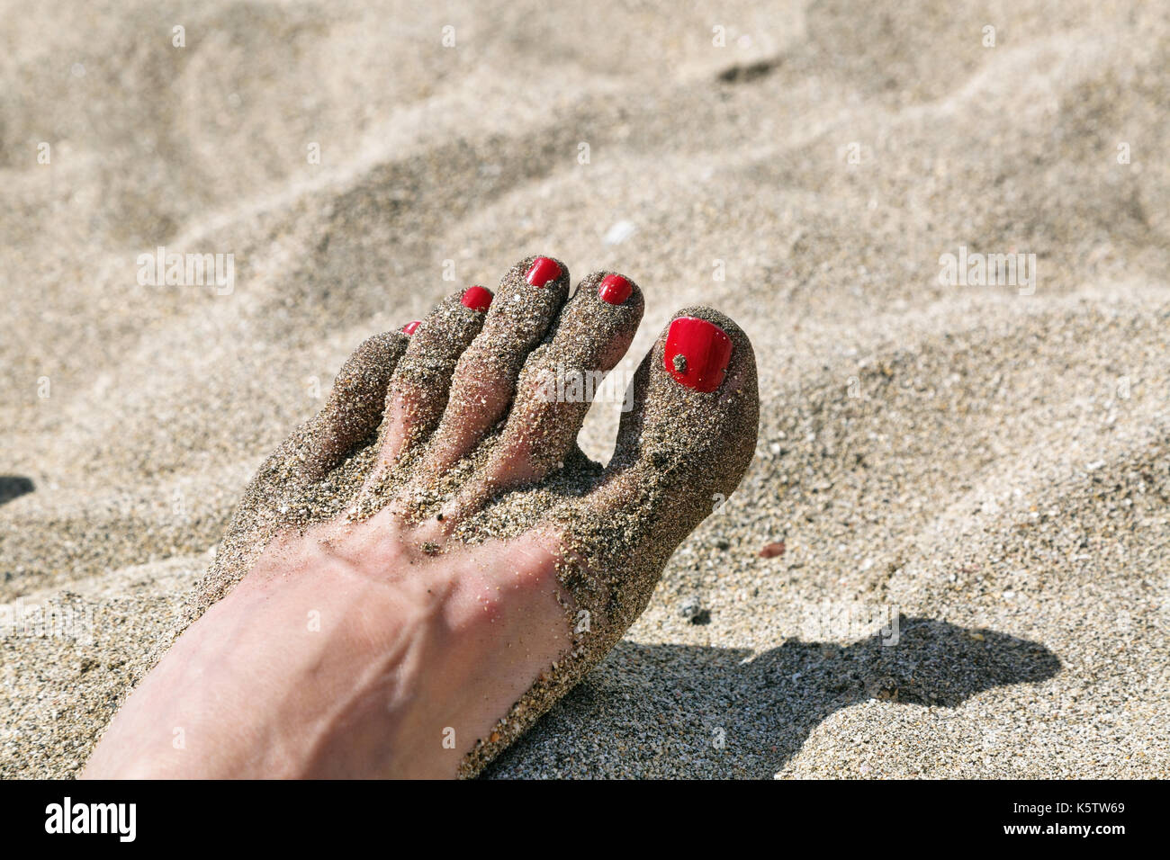Woman toes sand hi-res stock photography and images - Alamy