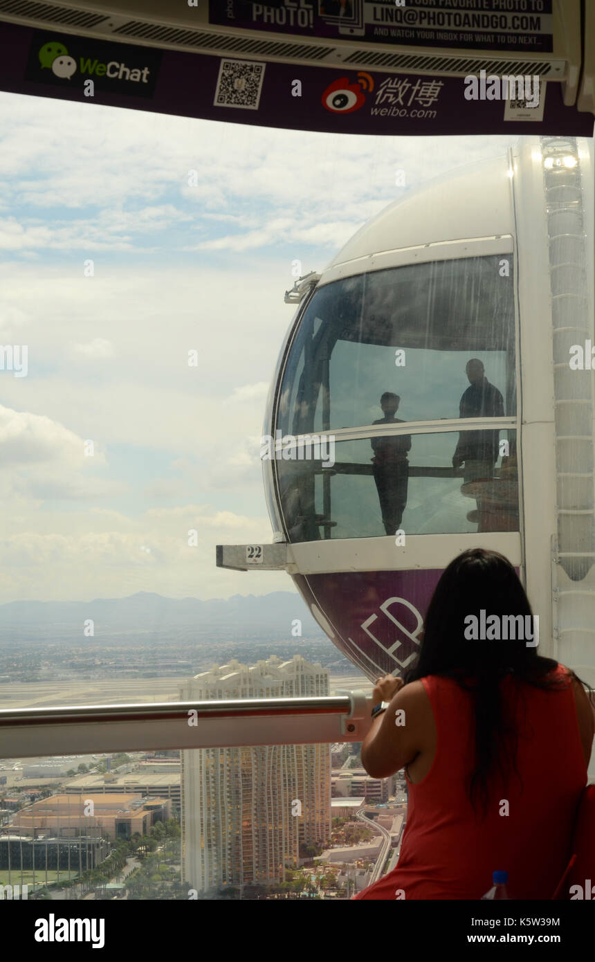 real people inside giant ferris wheel Stock Photo - Alamy