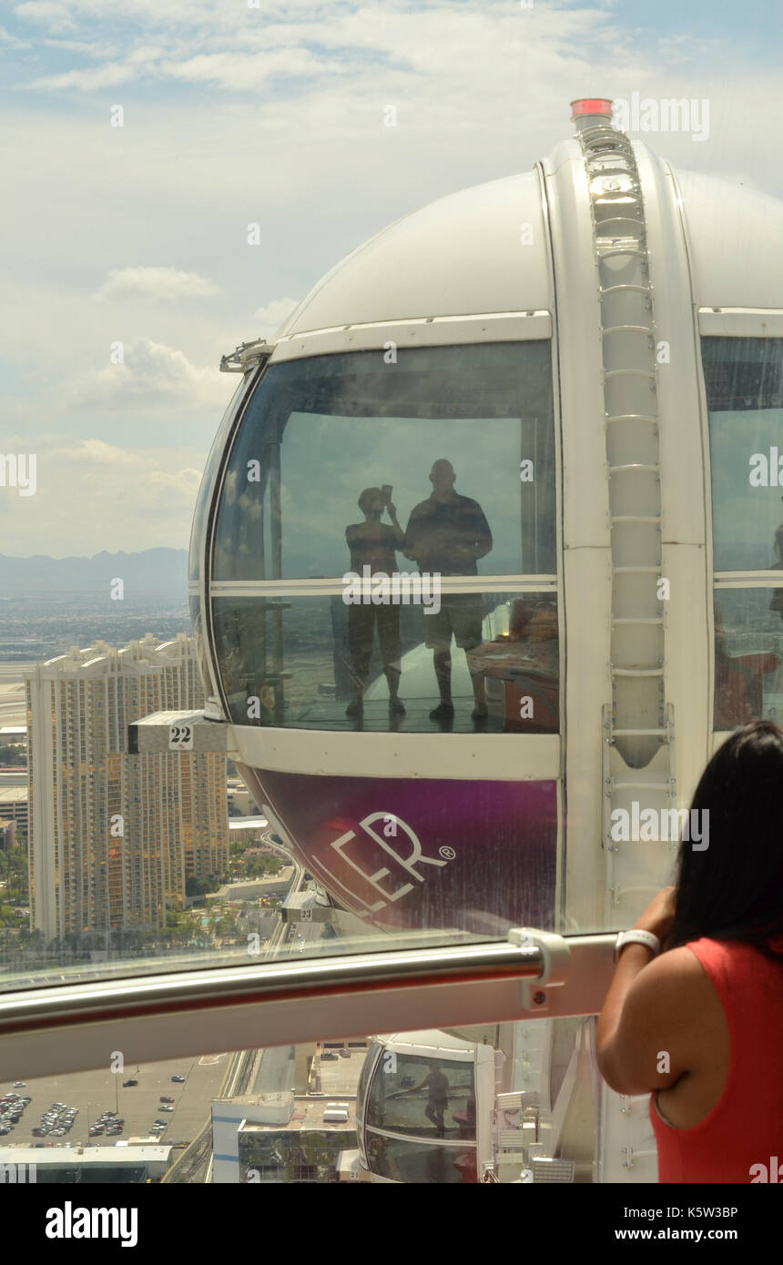 real people inside giant ferris wheel Stock Photo - Alamy