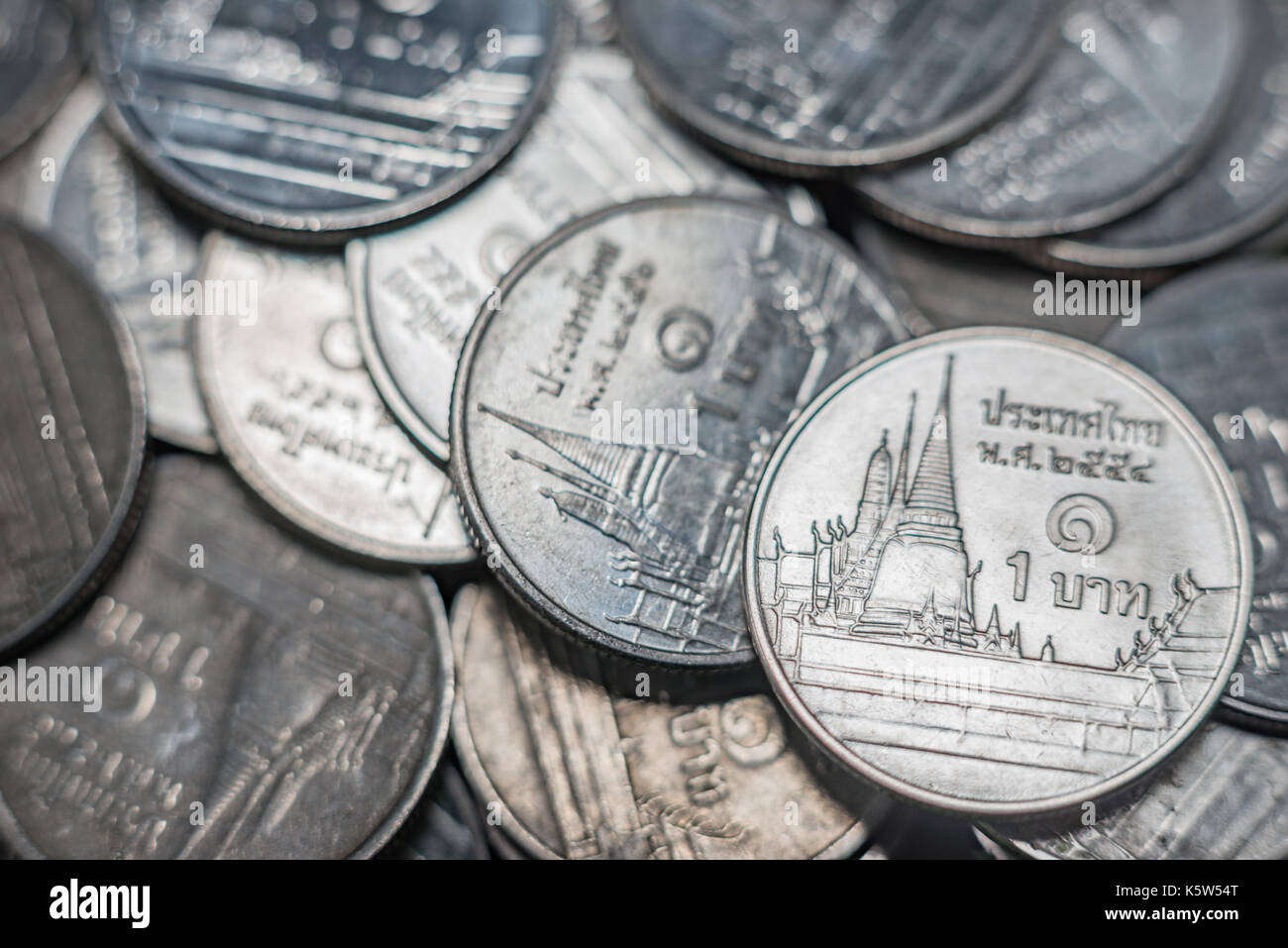 Thai baht coins with grass in background, Thai currency for exchange ...
