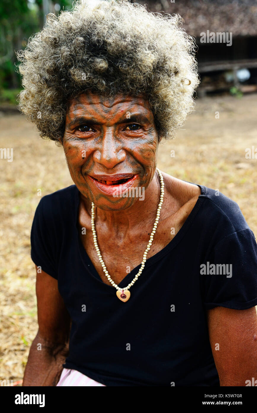 Folk tribe Korafe, woman with typical tattoo on her face, Tufi, Papua ...