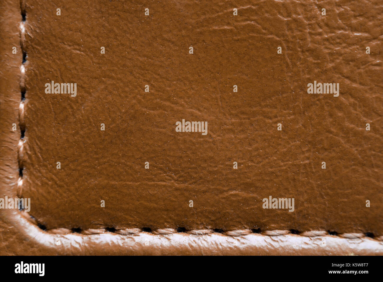 Texture of brown leather with stitches. Element of leather clothing ...