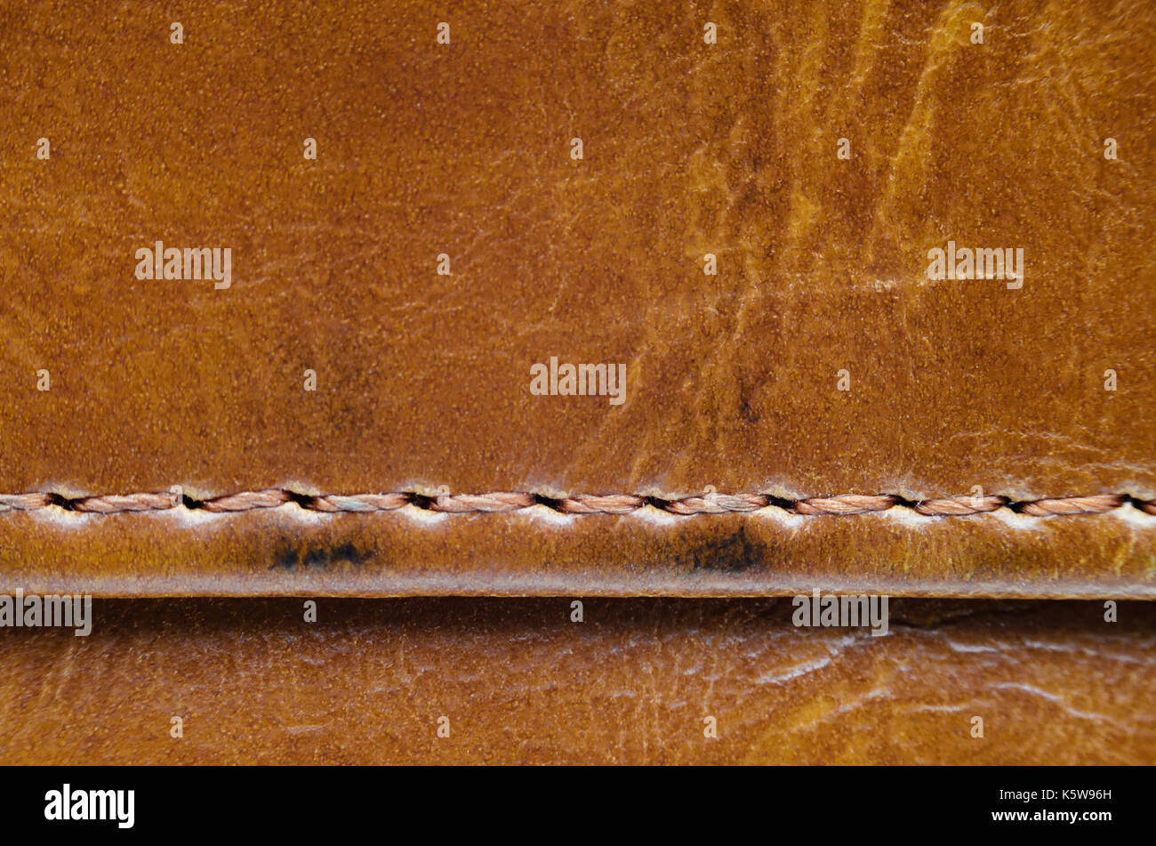 Texture of brown leather with stitches. Element of leather clothing ...
