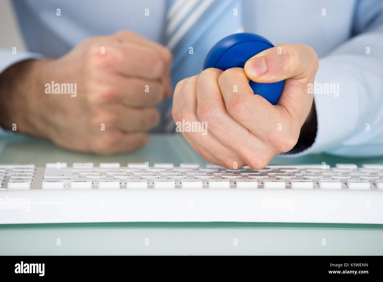Man pressing stressball hi-res stock photography and images - Alamy