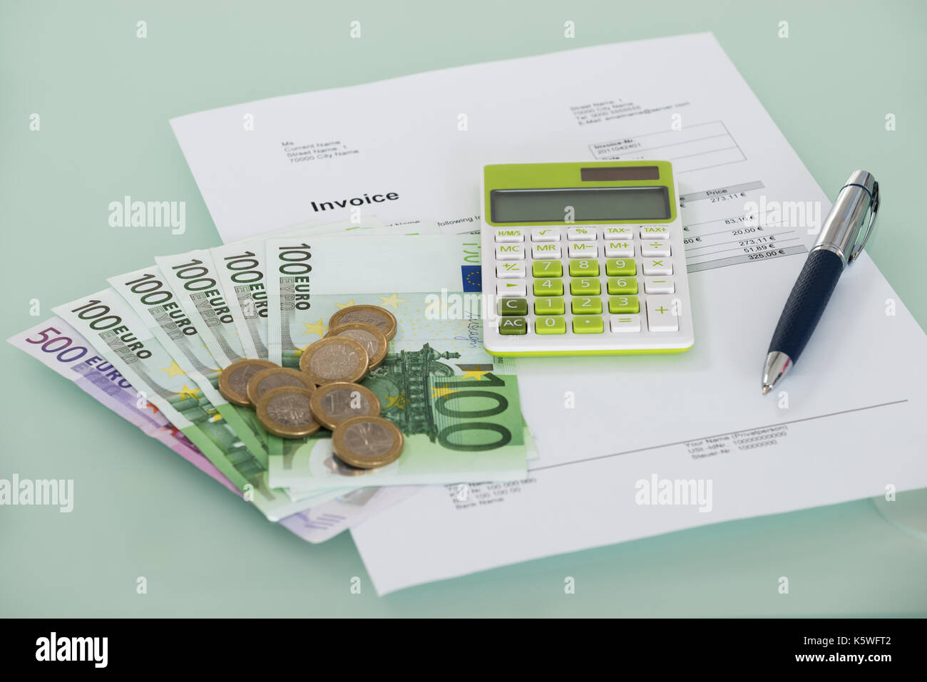 Close-up Of Invoice And Euro Currency On Desk Stock Photo - Alamy
