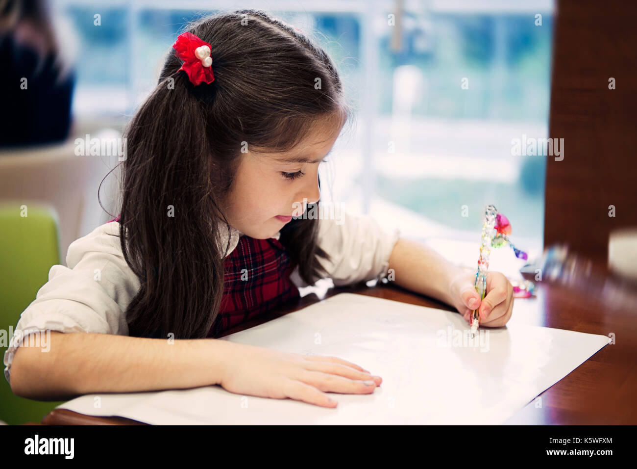 Little girl making homework Stock Photo - Alamy