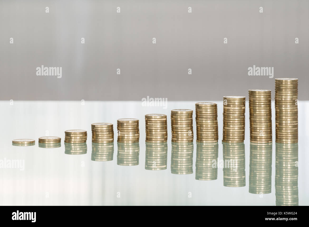 Close-up Photo Of Stacked Coins On Desk Stock Photo - Alamy