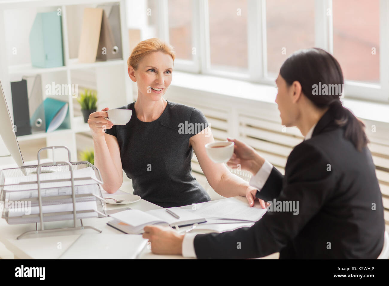 Talking by coffee Stock Photo - Alamy