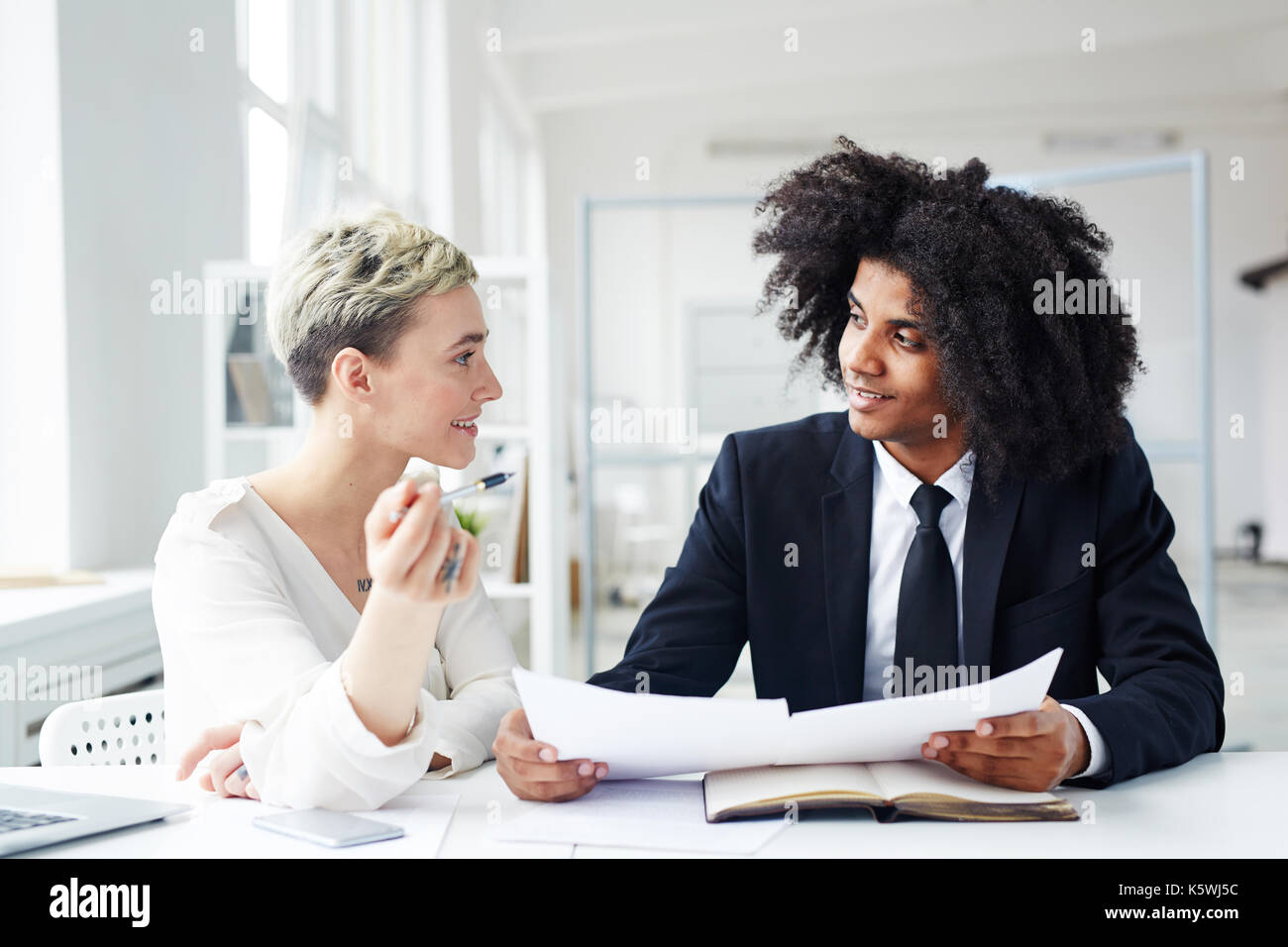 Teamwork of economists Stock Photo - Alamy