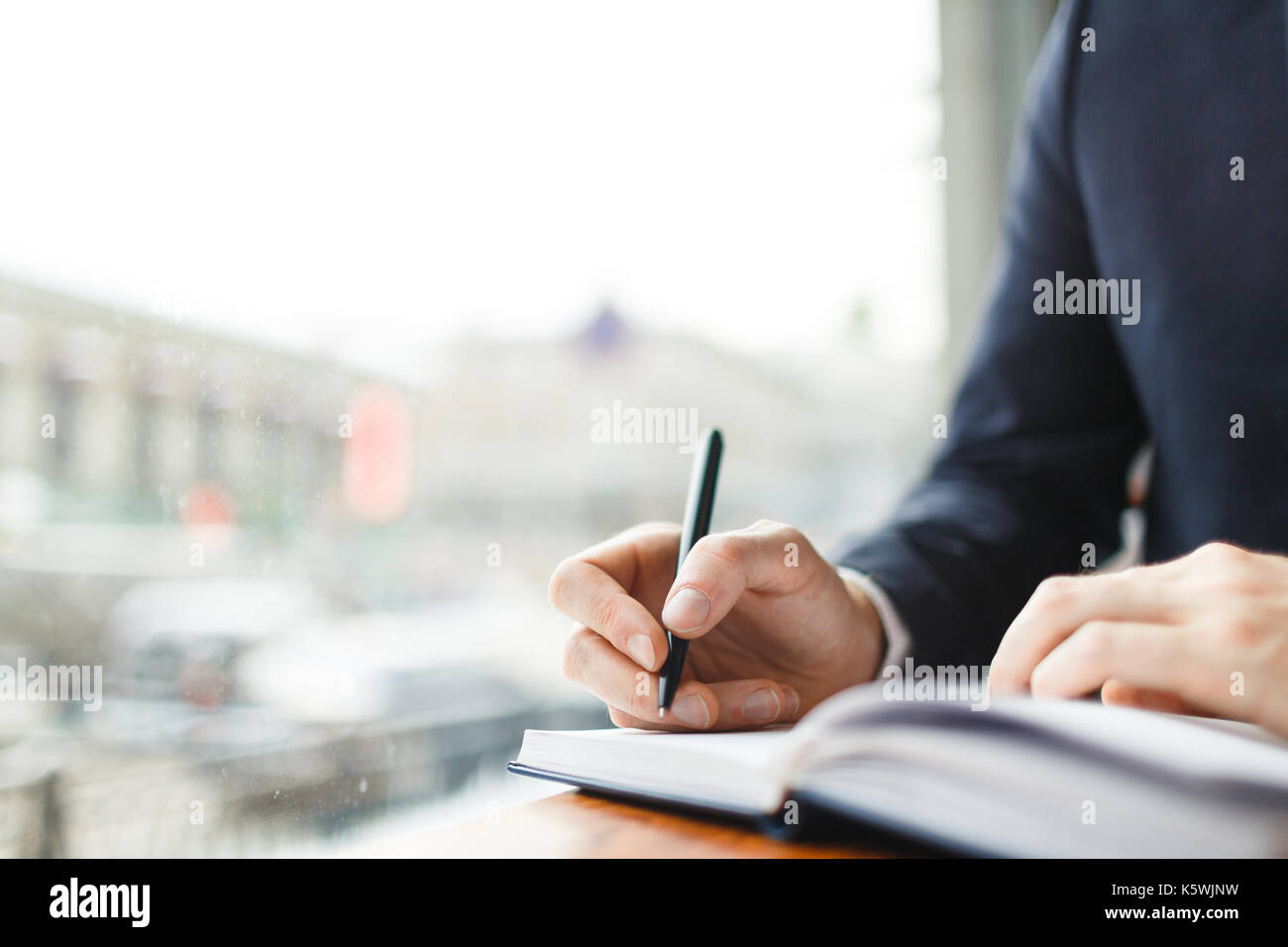 Writing down work schedule Stock Photo - Alamy