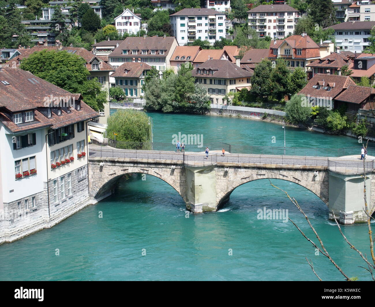 Stony bridge over clean alpine Aare river in city of Bern Stock Photo ...