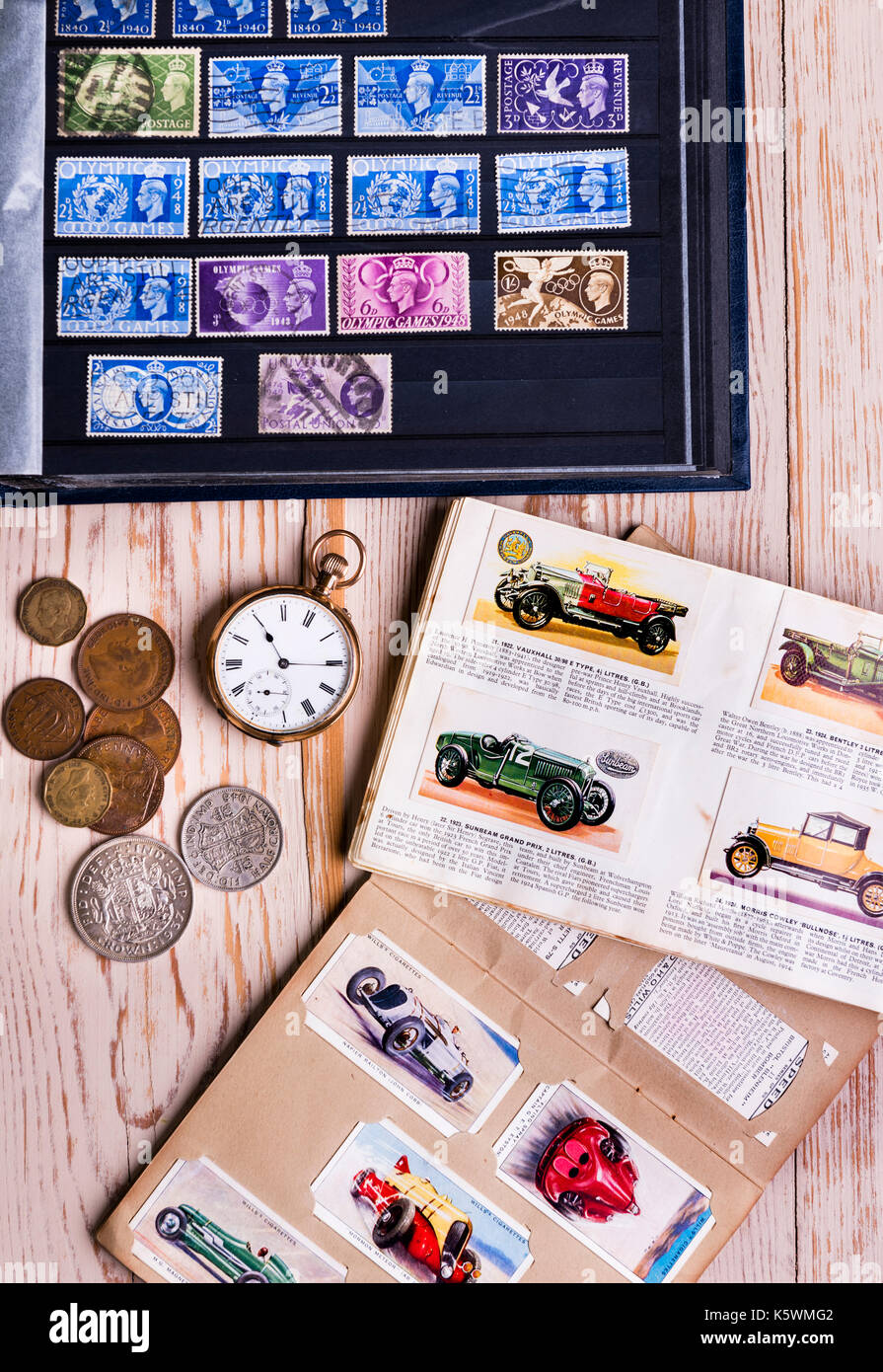 Stamps, cigarette cards, coins, watch. Collectable collection ...