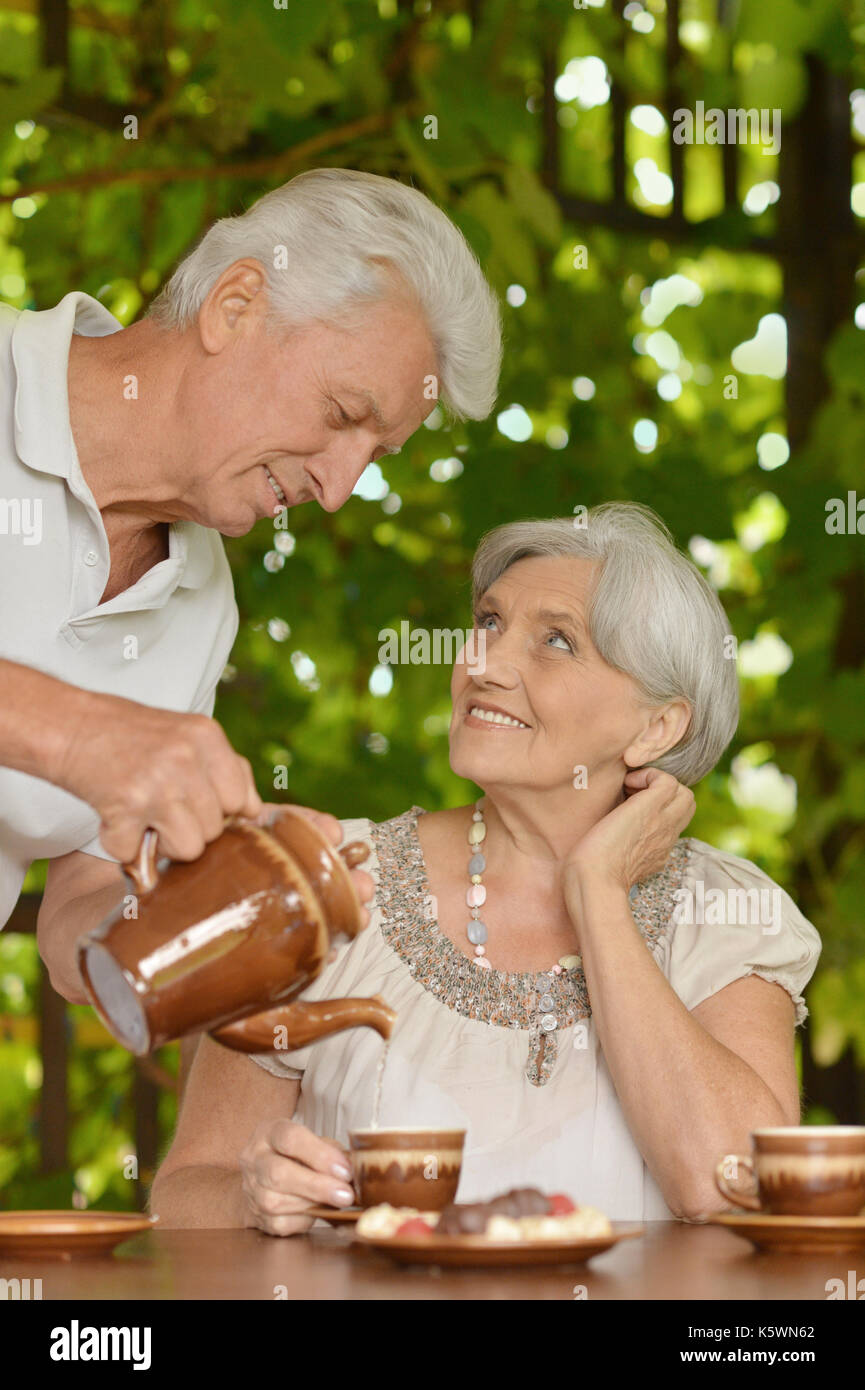 Senior man pouring tea Stock Photo - Alamy