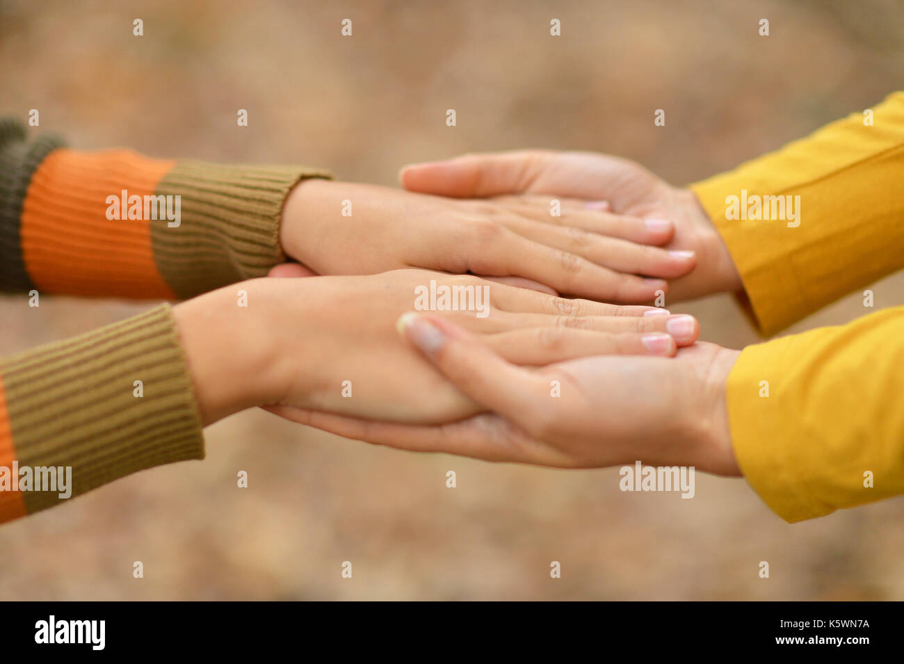 Two hands clasped together hi-res stock photography and images - Alamy