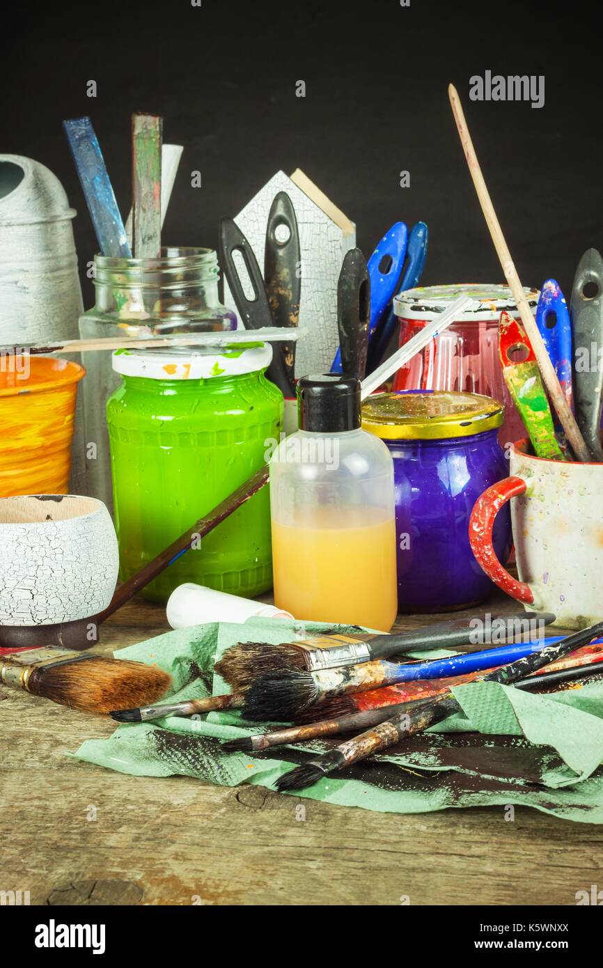 Decoupage products. Home Artist Workshop. Disorder on the work desk of ...