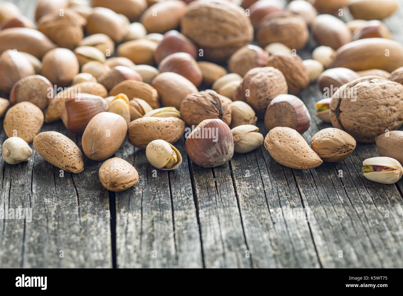 Different types of nuts in the nutshell. Hazelnuts, walnuts, almonds ...