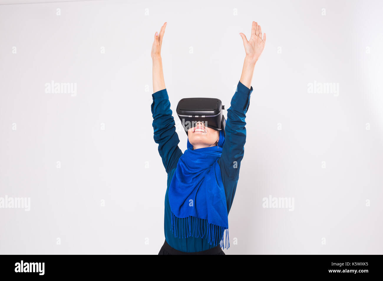 Asian muslim woman wearing hijab using VR headset glasses of virtual ...