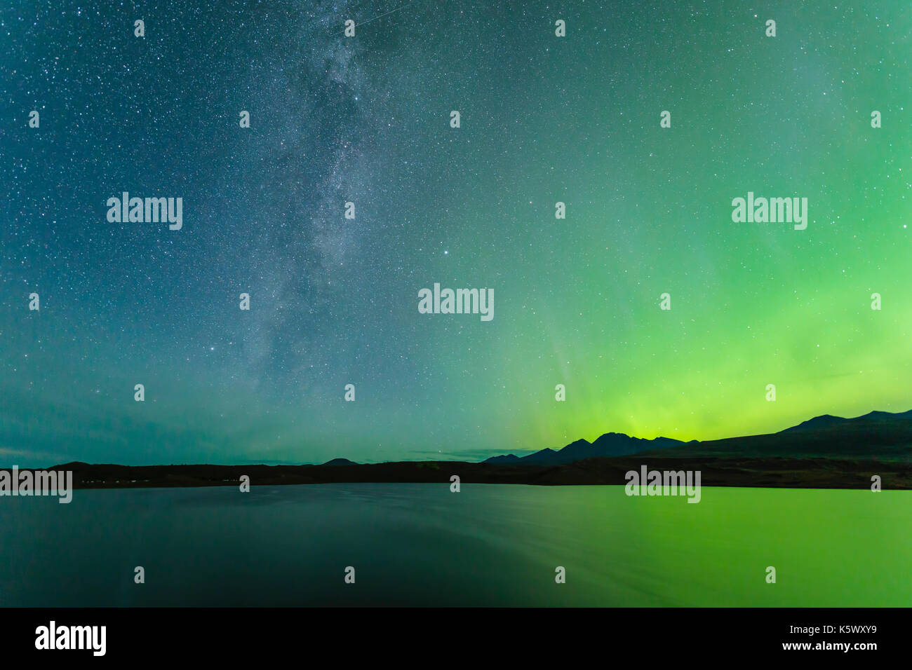Milky Way and Aurora Borealis above the Alaska Range mountains at Round ...