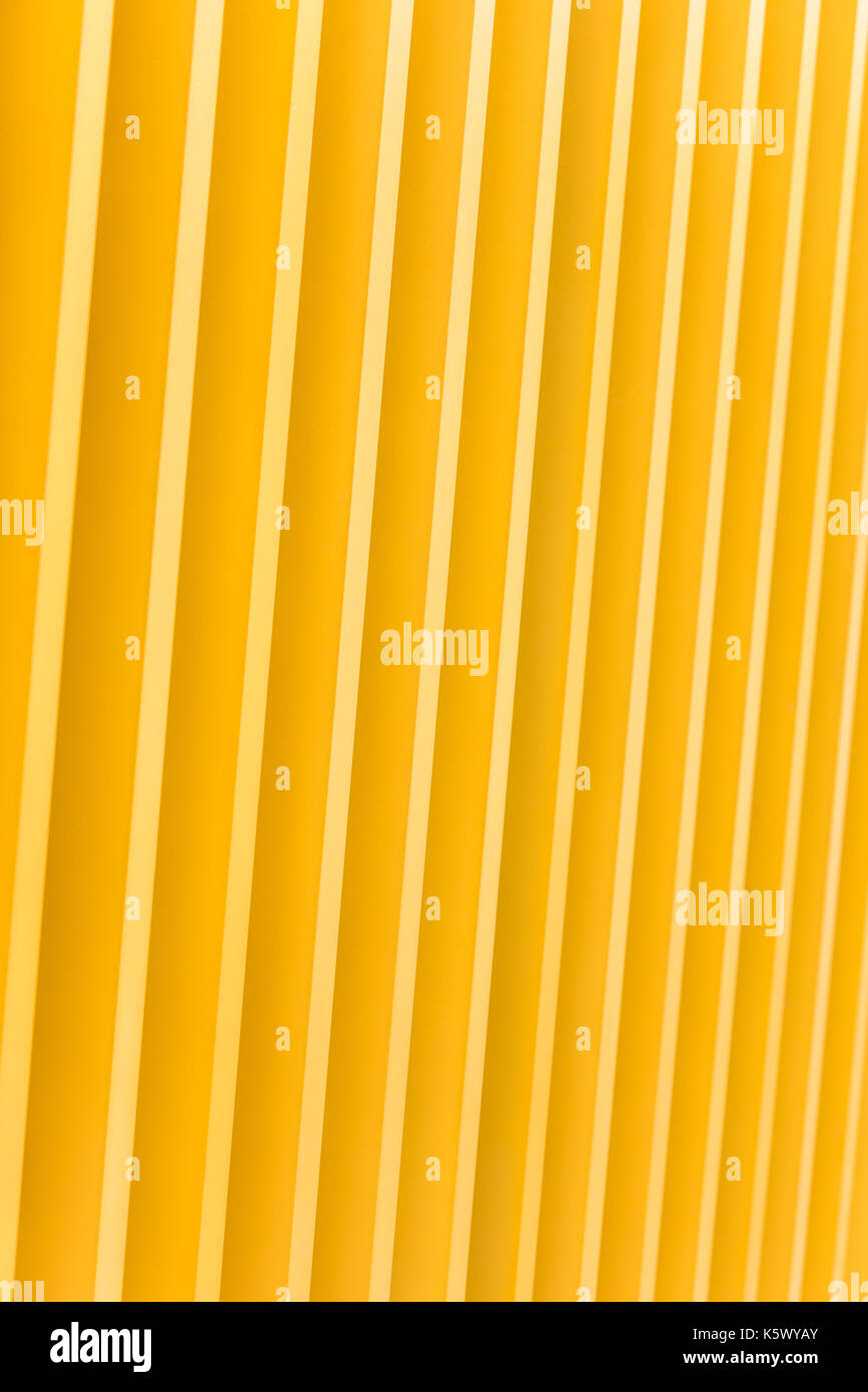 Detail of bright yellow metal building facade. For background Stock ...