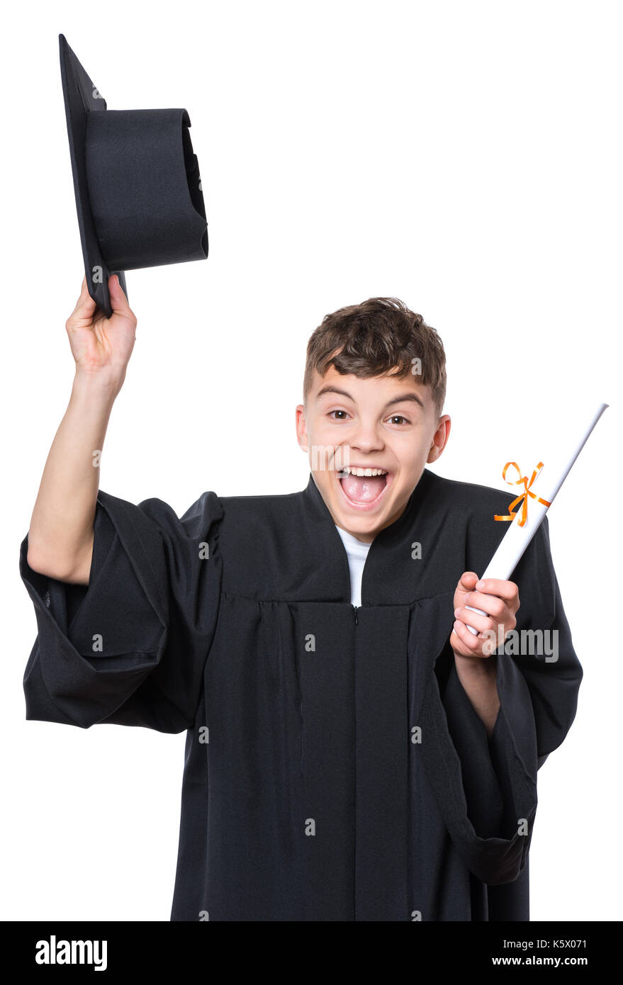 Portrait of happy graduate teen boy student in black graduation gown ...