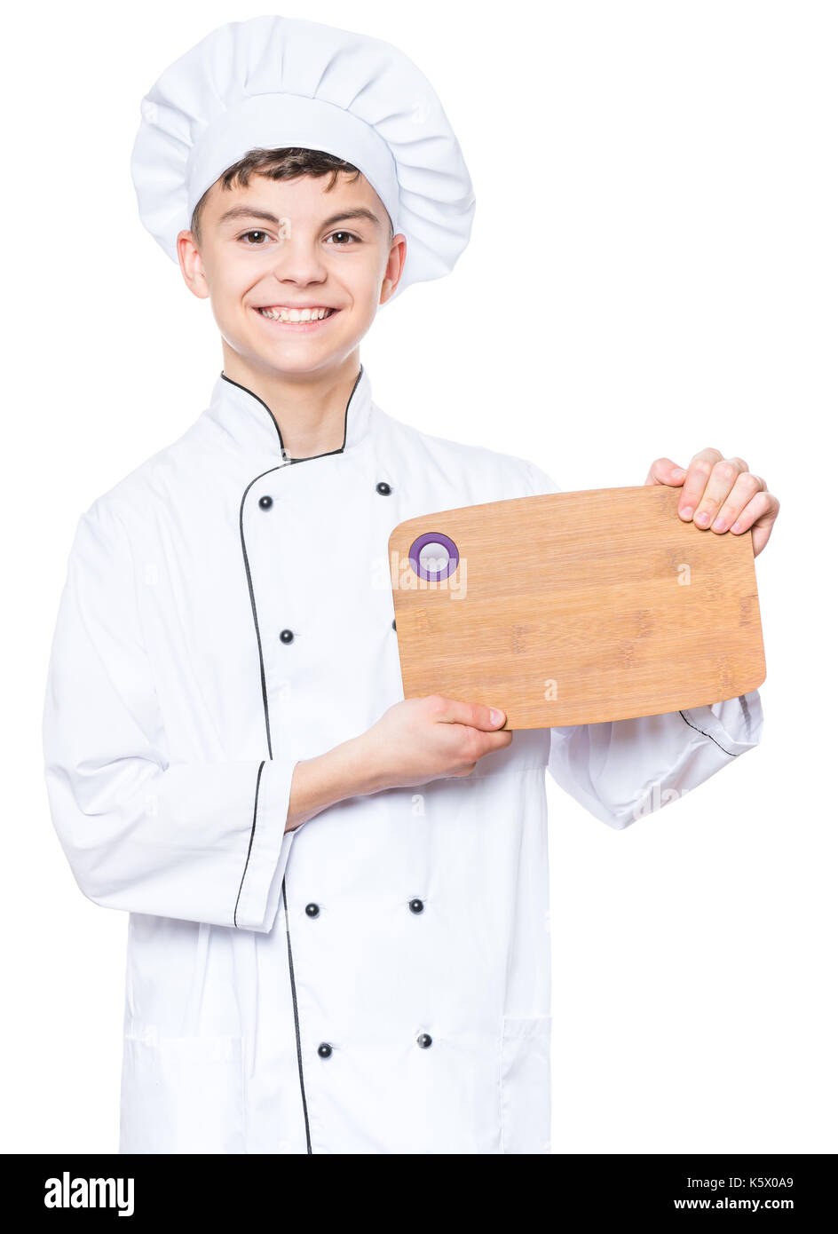 Cheerful handsome teen boy wearing chef uniform. Portrait of a happy ...